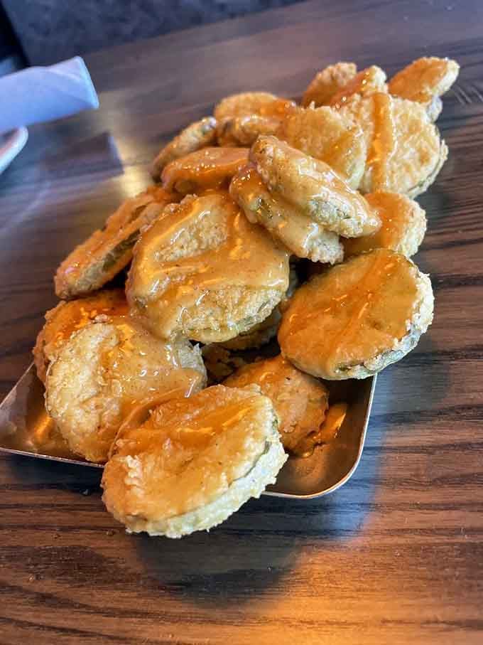 These golden-fried pickle chips are dangerously addictive, the kind of appetizer that disappears before you realize it.