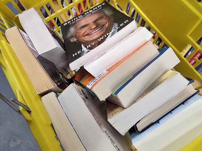 A shopping cart brimming with literary finds proves that budgets and book addiction can somehow coexist peacefully.