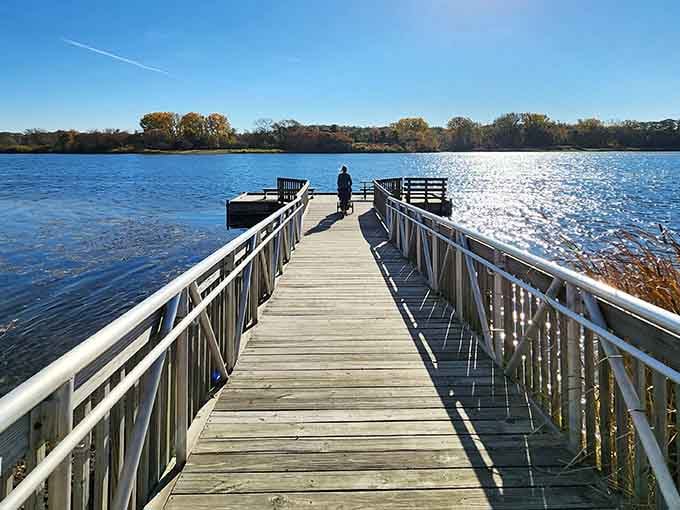 The fishing pier extends into Sterling Lake like a wooden highway to tranquility and maybe dinner.