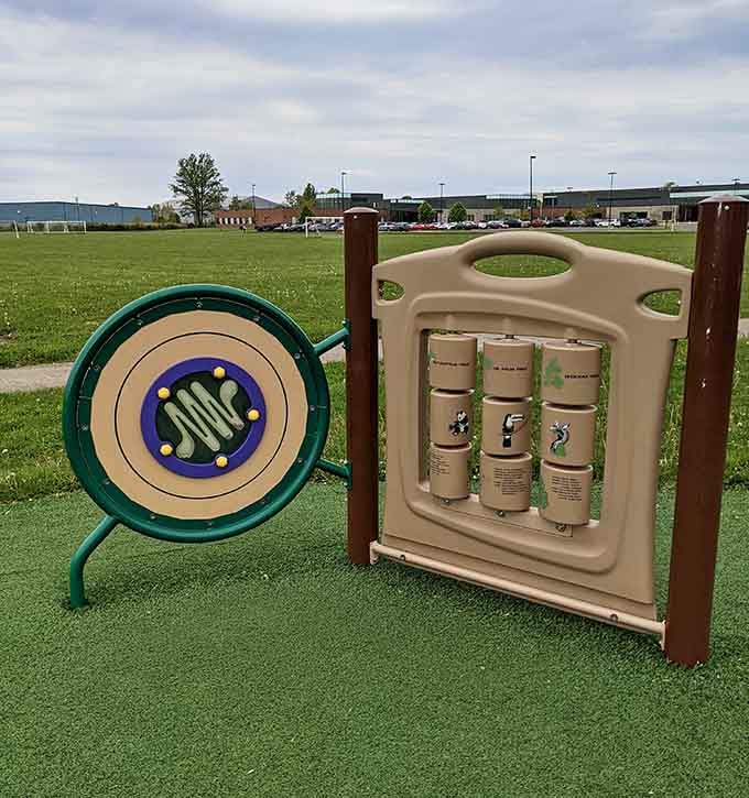 Interactive play panels keep little minds engaged while giving parents a brief moment to catch their breath on nearby benches.