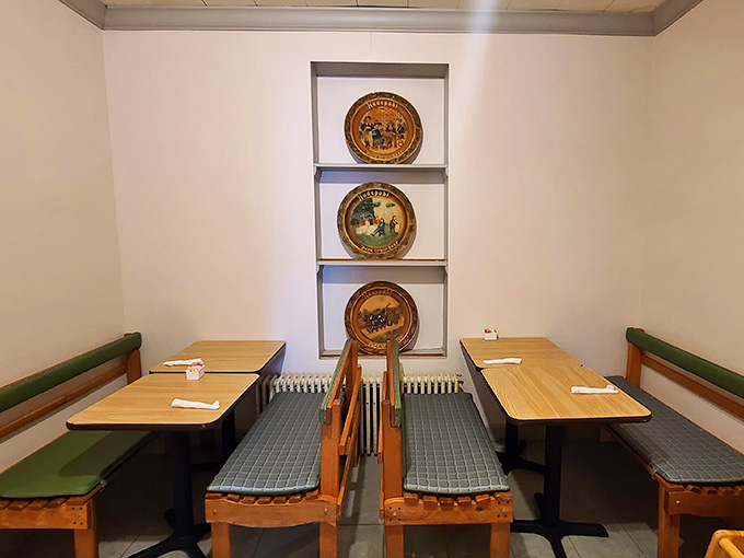 Clean, simple dining spaces with decorative plates remind you that sometimes the best restaurants don't need fancy decor, just great food.