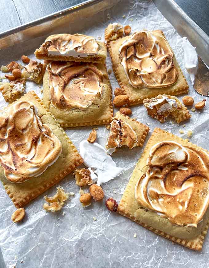 Torched meringue tops these peanut butter cheesecake Weeshtarts, adding restaurant-level technique to a Pop-Tart format for an elevated dessert experience worth savoring slowly.