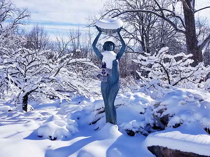 Winter transforms the gardens into a frosted wonderland where sculptures wear nature's finest white coats.