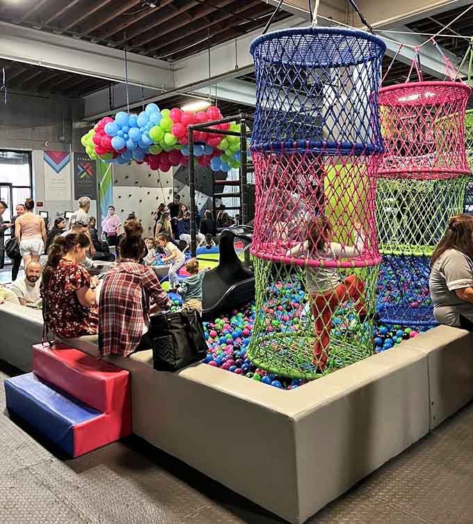 Families gather around colorful ball towers and climbing structures, creating memories that'll outlast any store-bought toy at home.