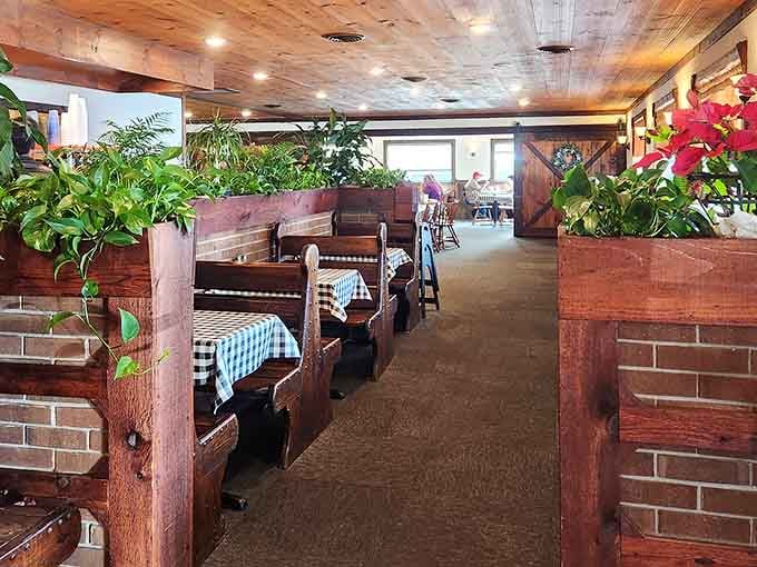 Cozy booth seating with wood paneling creates that warm, welcoming vibe. Settle in and stay awhile, friend.