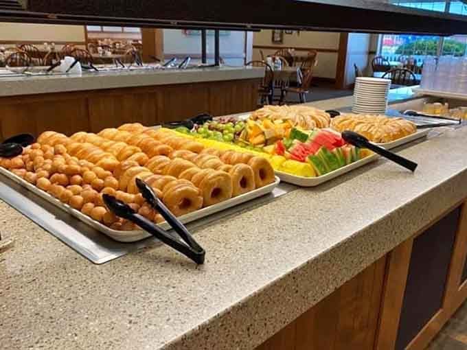 Rows of fresh donuts lined up like edible soldiers, ready to wage war on your diet and win decisively.
