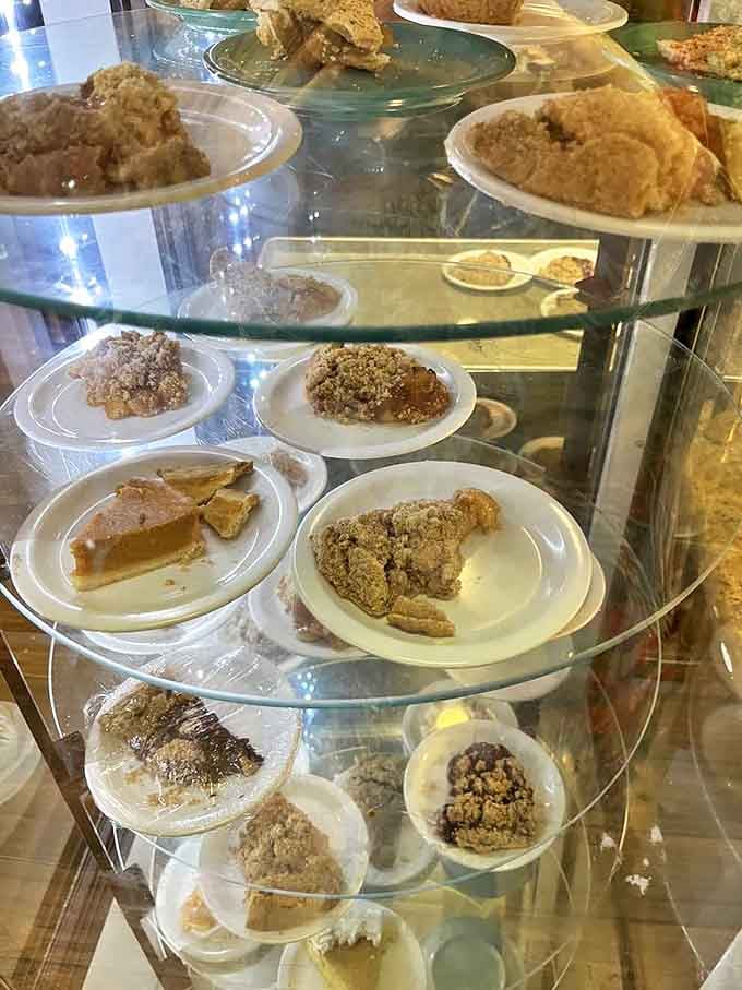 The pie display case is like a museum of deliciousness where every exhibit deserves your immediate attention and appreciation.