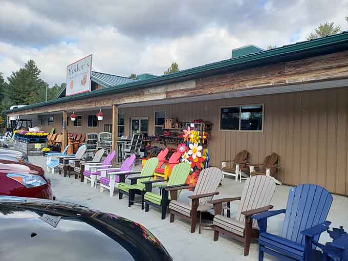 Adirondack chairs in every color of the rainbow, because your backyard deserves to look like a cheerful paint sample display.