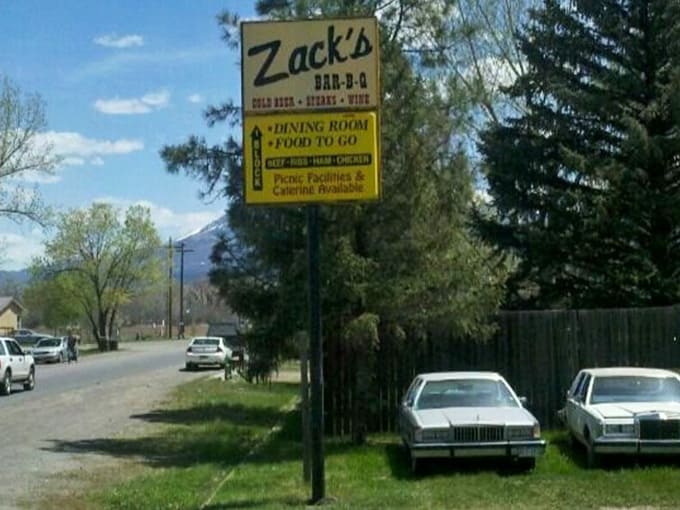 That yellow roadside sign beckons like a beacon for hungry travelers who trust their instincts and their stomachs.
