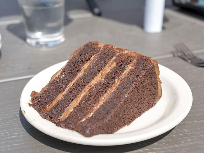Chocolate cake at Zingerman's Delicatessen stands tall and proud, each layer promising pure dessert bliss ahead.