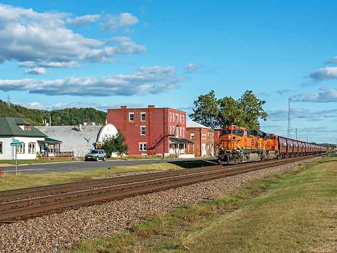 When freight trains rumble past historic red brick buildings, you're witnessing the heartbeat of authentic small-town America.