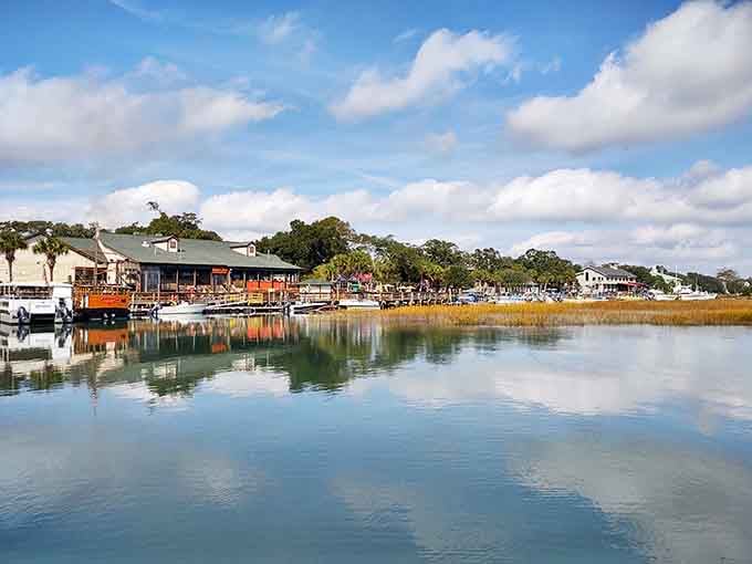 The waterfront reflects boats and buildings perfectly, creating a mirror image that doubles the charm here.