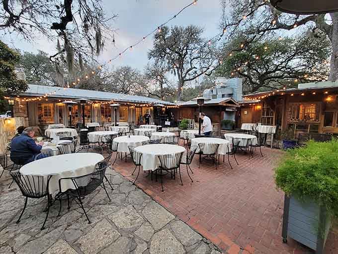 Those glowing lights strung between the oaks set the perfect mood for romance and ribeyes.