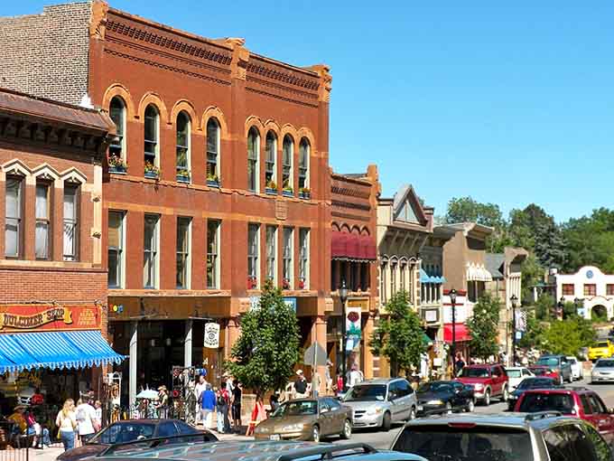 Victorian storefronts march up the street in cheerful colors, each one competing to be the most photographed building today.