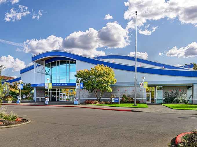This modern aquatic center's blue curves and glass walls promise year-round water fun, rain or shine, hot or cold.