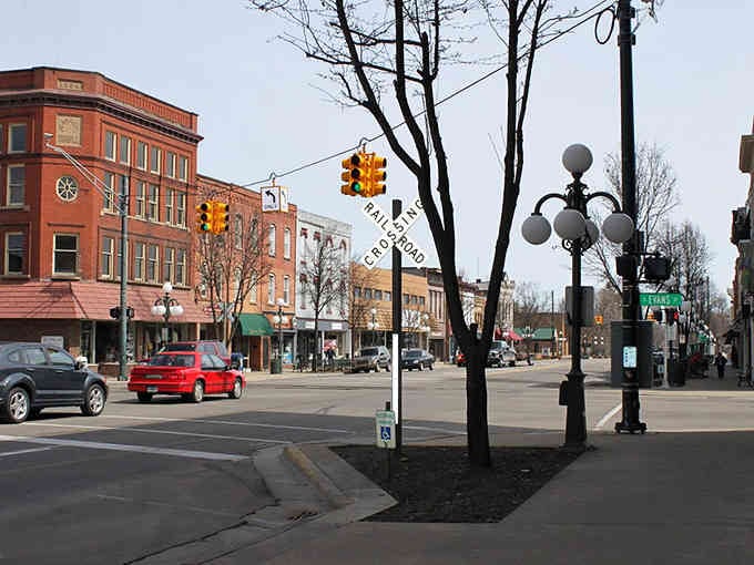 Classic street lamps and vintage traffic signals frame a downtown that values its heritage without becoming a museum.
