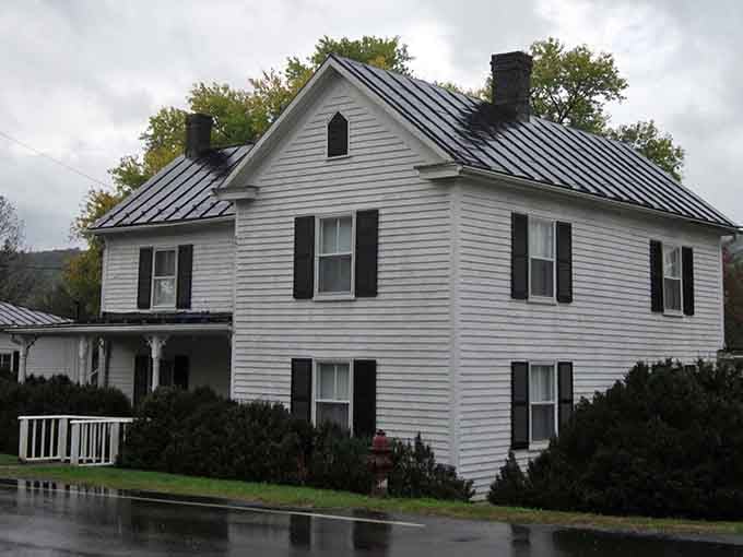 Classic white clapboard and black shutters create that timeless look your grandmother would call "just right" every time.