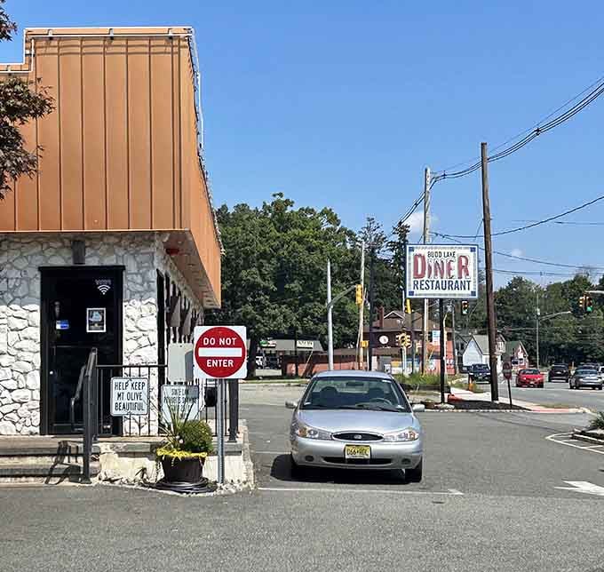 That vintage sign and stone facade combo feels like discovering your grandfather's favorite roadside stop from the fifties.