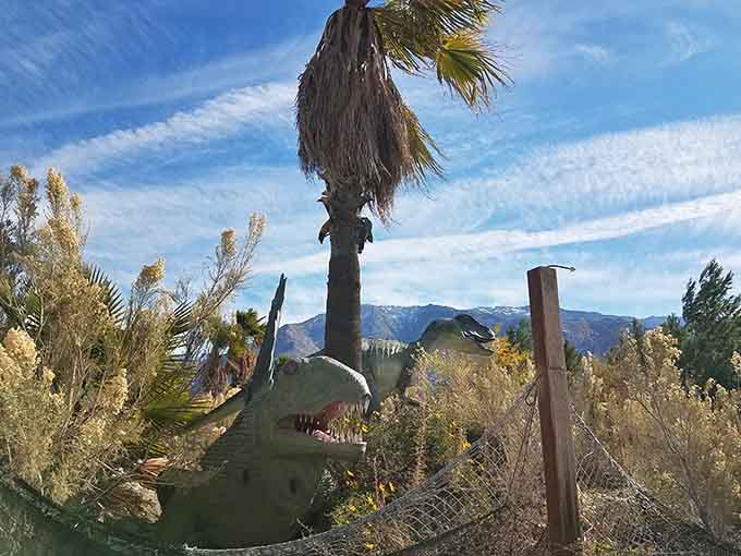 Palm trees and towering mountains backdrop these prehistoric giants in a wonderfully weird slice of roadside Americana.