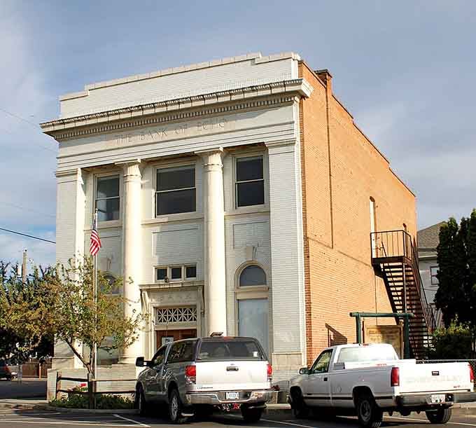 Classical columns and "The Bank" inscription speak to an era when buildings were constructed with dignity and permanence.