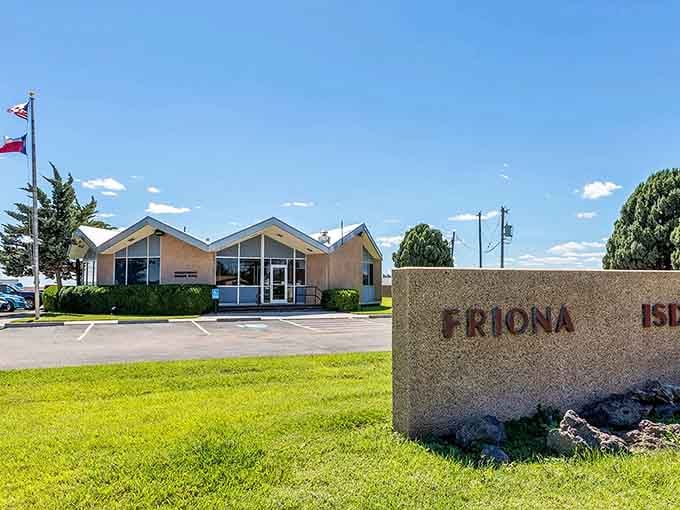 Green lawns and the Friona ISD sign welcome you to wide-open spaces where costs stay refreshingly low.
