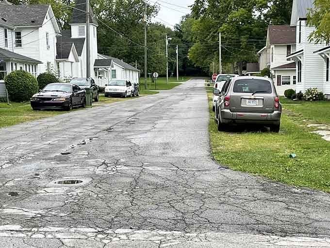 Wide residential streets stretch quietly into the distance where neighbors actually know each other's names still.