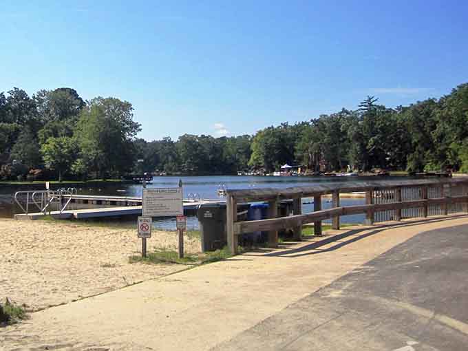 Sandy shores meet calm waters in this peaceful retreat where boats bob gently and worries drift away.