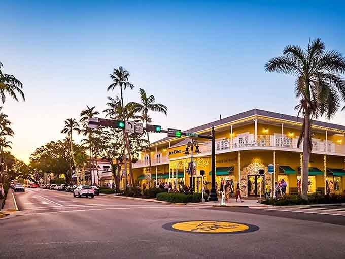 Sunset shoppers meander beneath swaying palms where every evening feels like a celebration of the good life.