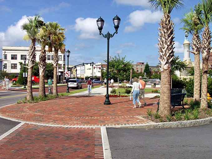 Palm trees sway near brick walkways, creating that perfect blend of Southern charm and coastal ease without beach prices.