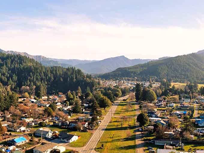 From above, the road cuts through town like a patient storyteller, winding gently beneath mountains that have seen it all.