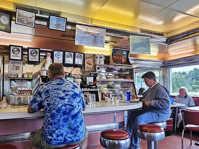 Counter seating where regulars gather, stories flow, and the coffee never stops coming your way.
