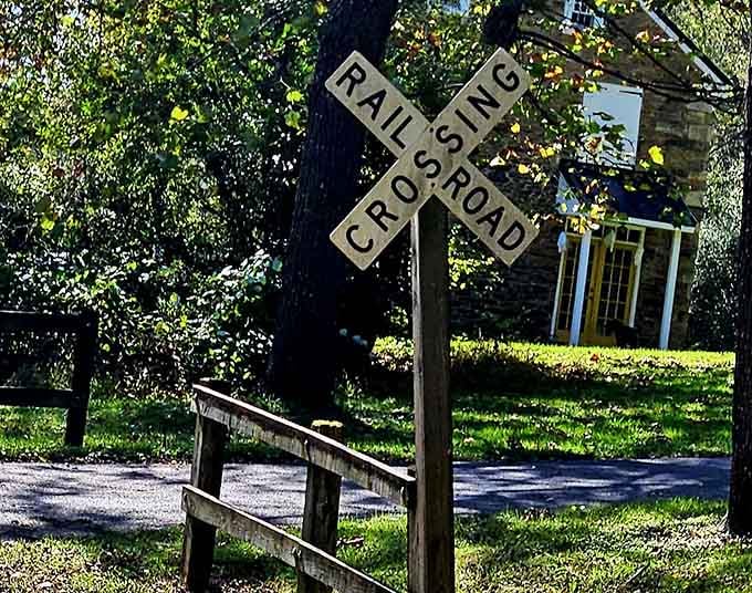 That classic railroad crossing sign marks where ordinary roads meet extraordinary adventures, a threshold worth crossing every time.
