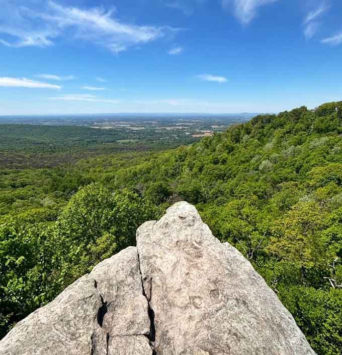 The overlook reveals Maryland's mountains stretching endlessly, like waves frozen in time and covered with trees.