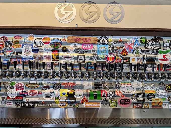 That tap wall covered in brewery stickers tells stories of countless perfect pairings with smoked meats.