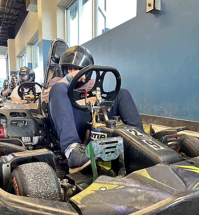 Strapped in and focused, this driver prepares mentally for battle, channeling their inner Mario Andretti before hitting the track.