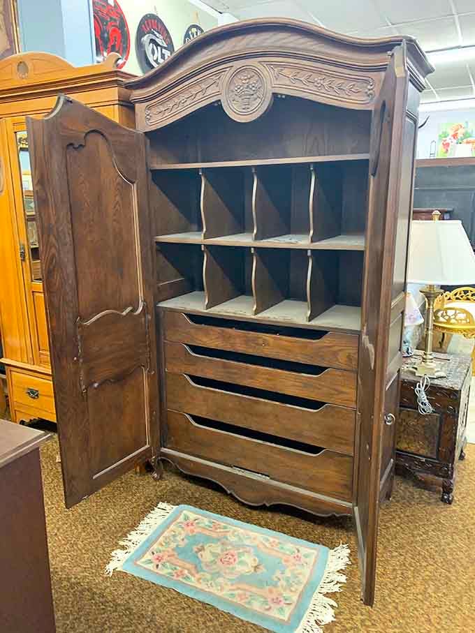 This ornate wooden cupboard has more character in its carved details than most modern furniture has altogether.