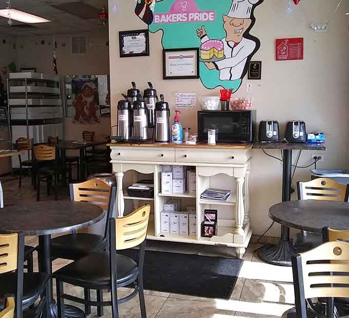 Coffee station with the bakery's cheerful logo, because great donuts deserve equally great caffeinated companions for the journey.