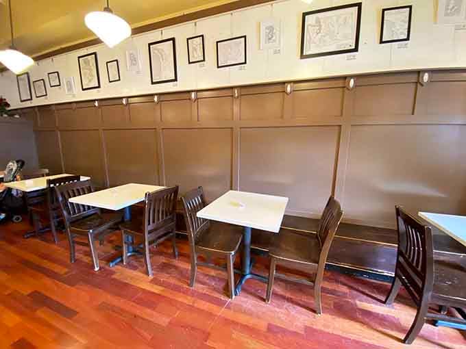 Framed artwork and wooden booths create the perfect setting for contemplating your third croissant of the morning.
