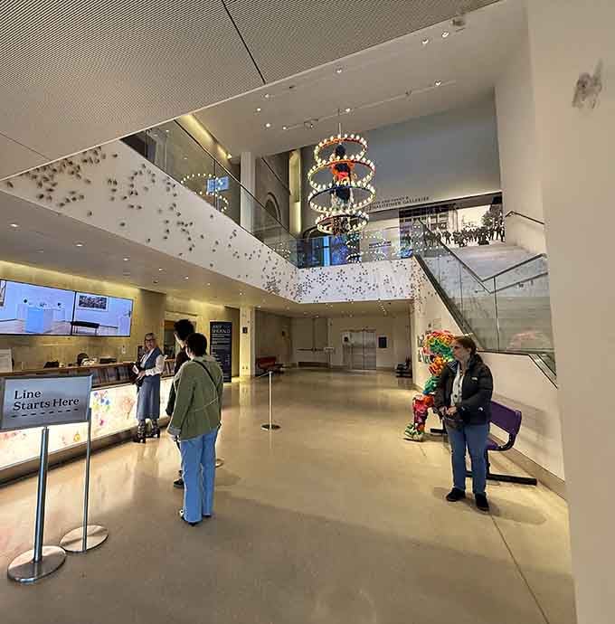 The modern lobby blends contemporary design with classical elements, making art accessible to every visitor who enters.