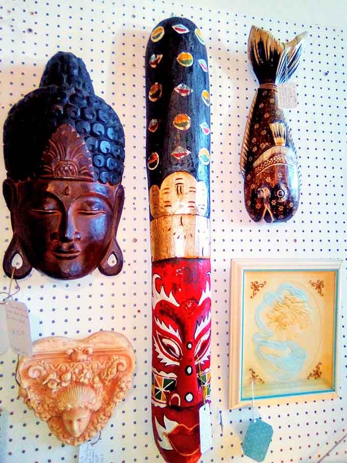 Buddha meets folk art in this eclectic wall display that celebrates global craftsmanship from multiple continents and cultures.