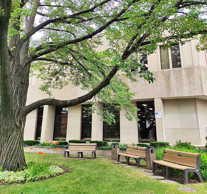 The Berwyn Public Library welcomes readers with benches, green space, and that timeless promise of knowledge within.