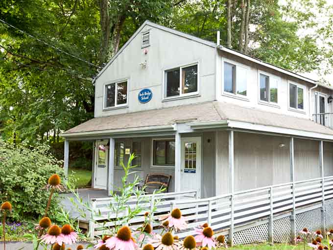 Sunflowers and white porches create that storybook charm that makes you want to slow down and actually enjoy summer afternoons.