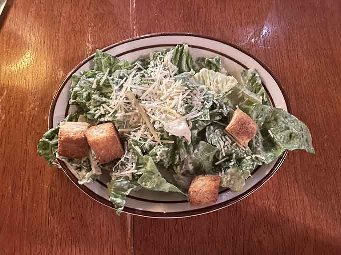 A Caesar salad this generous with cheese and croutons actually counts as a legitimate meal, not just rabbit food.