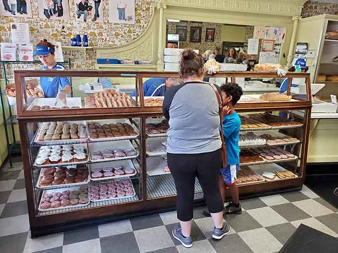 Three generations deciding which treats to take home, a scene that's played out here for nearly a hundred years.