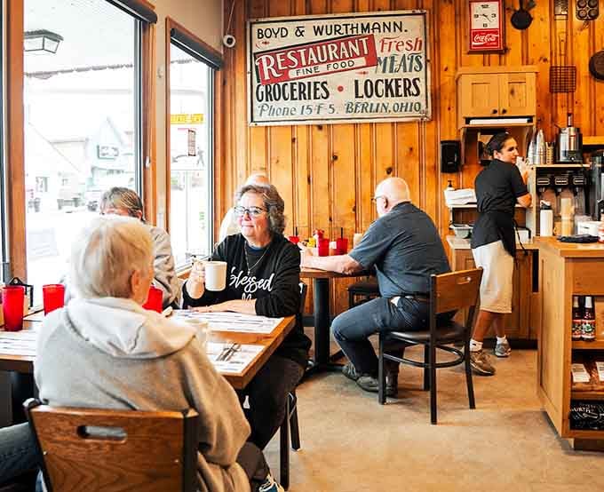 Locals and visitors sharing space and stories, proving good food brings people together across all differences.