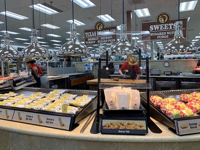 Behind-the-scenes action at the prepared food stations where fresh treats emerge throughout the day continuously.