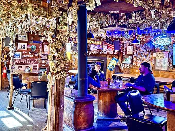 When the dollar-covered ceiling becomes your dining room view, you're eating somewhere that values character over corporate polish.