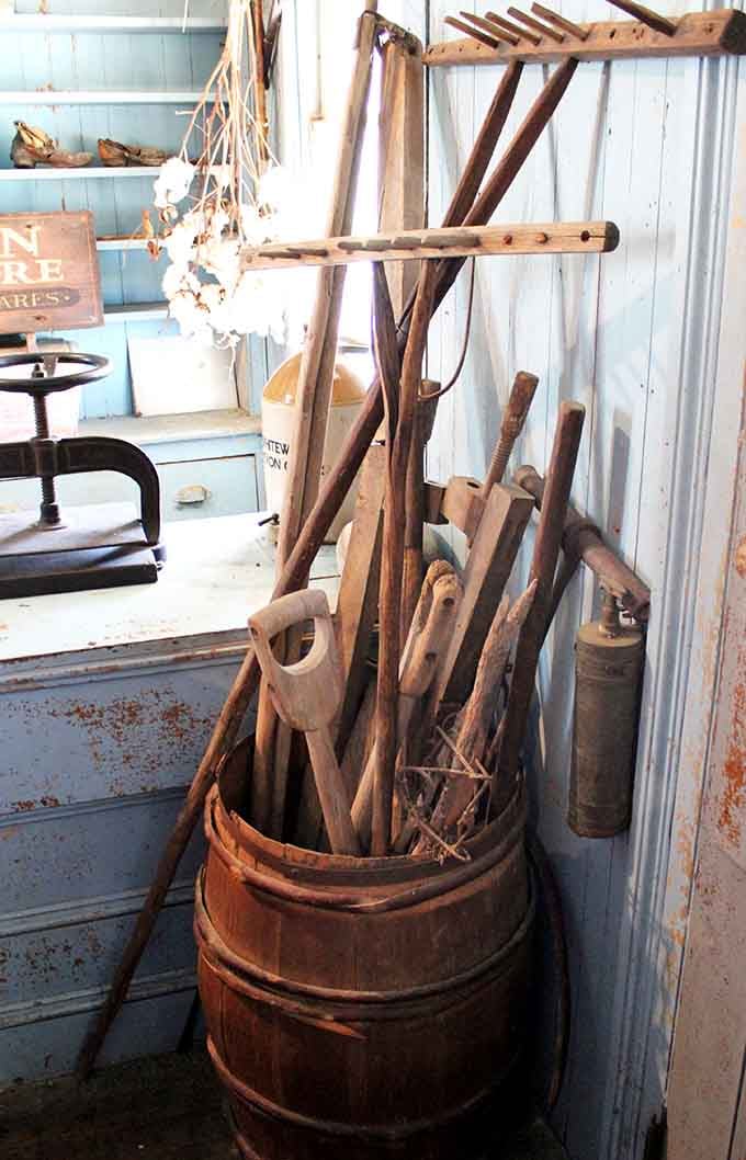 Farm tools that built communities now rest as reminders of backbreaking work our ancestors endured daily.