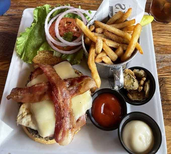 The Brunch Burger layers bacon strips like a delicious lattice, because apparently breakfast and lunch had an amazing collaboration meeting.