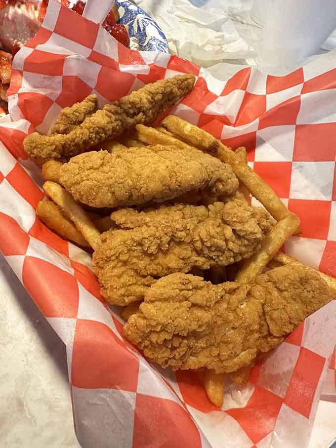 Golden fried chicken strips that crunch louder than Elvis's blue suede shoes ever did, absolutely magnificent.